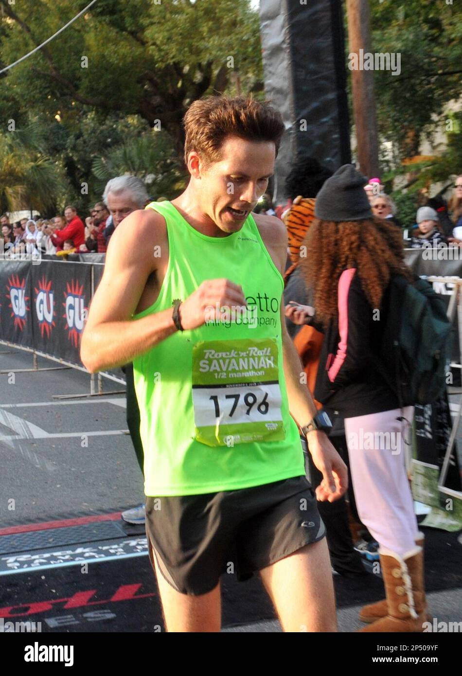 Craig Dye, of Bluffton,SC., crosses the finish line to win the Rock 'n ...