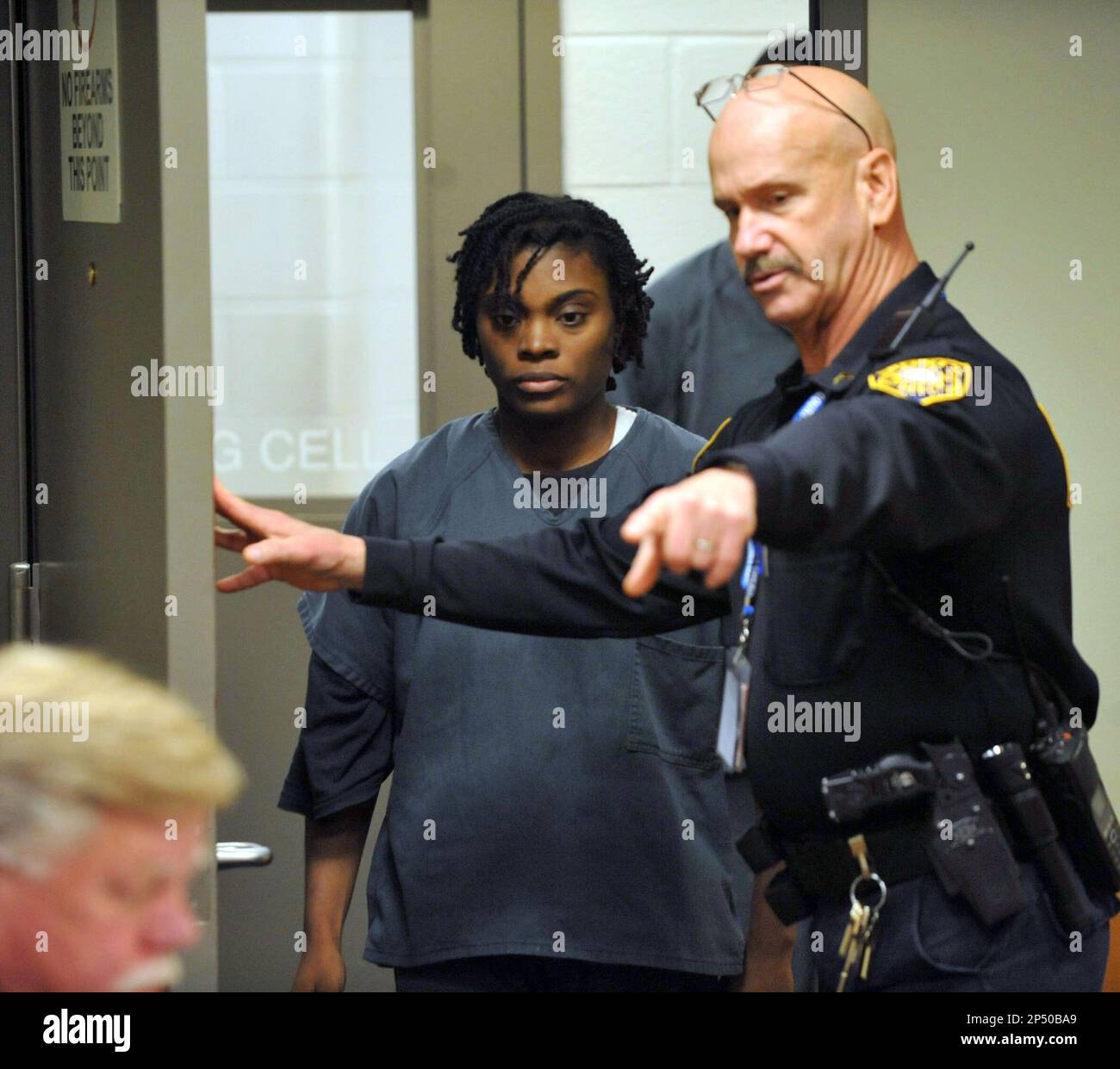 Tiffany Moss enters Magistrate Court Friday Nov. 8, 2013. The parents ...