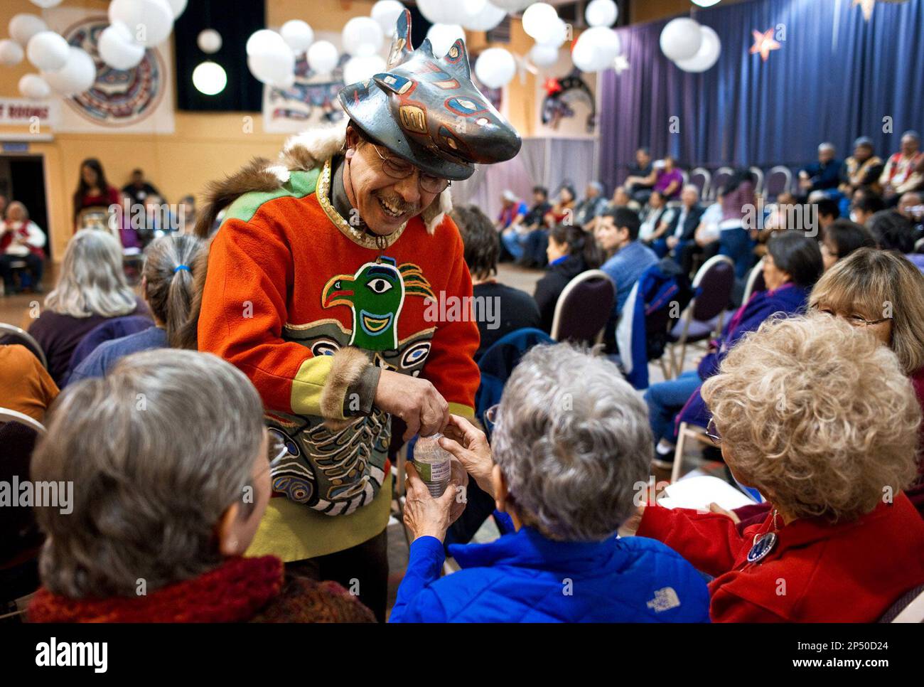 Michael Tagaban, of the Wooshkeetaan Clan, brings water to elders ...