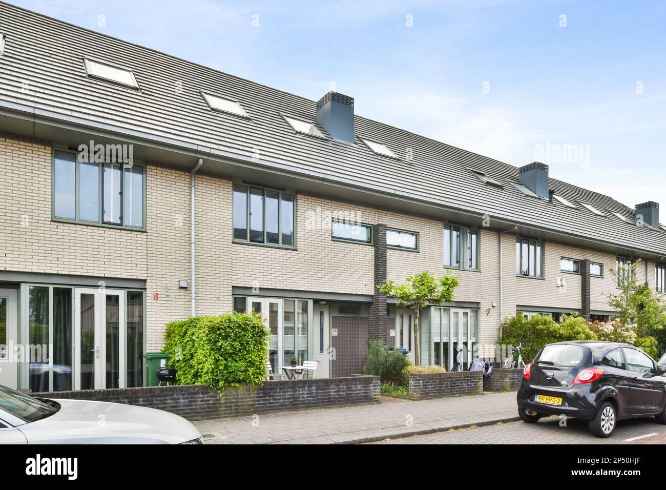 an apartment complex with cars parked in the driveway and buildings on ...