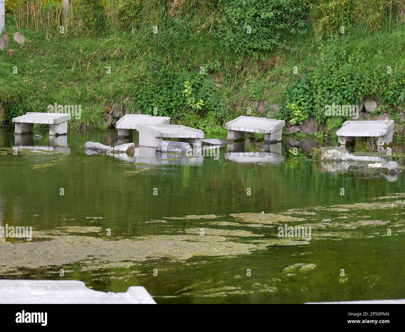 Washing in the Wild: Public Laundry Facilities in a River Stock Photo ...