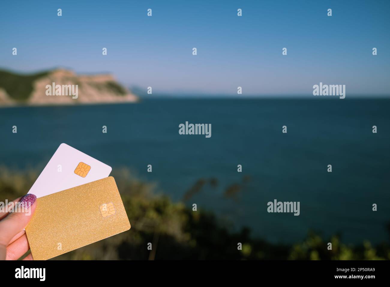 Golden and White Bank Card In Woman Hand On Background Of Scenic View From Arkoudilas Viewpoint ...