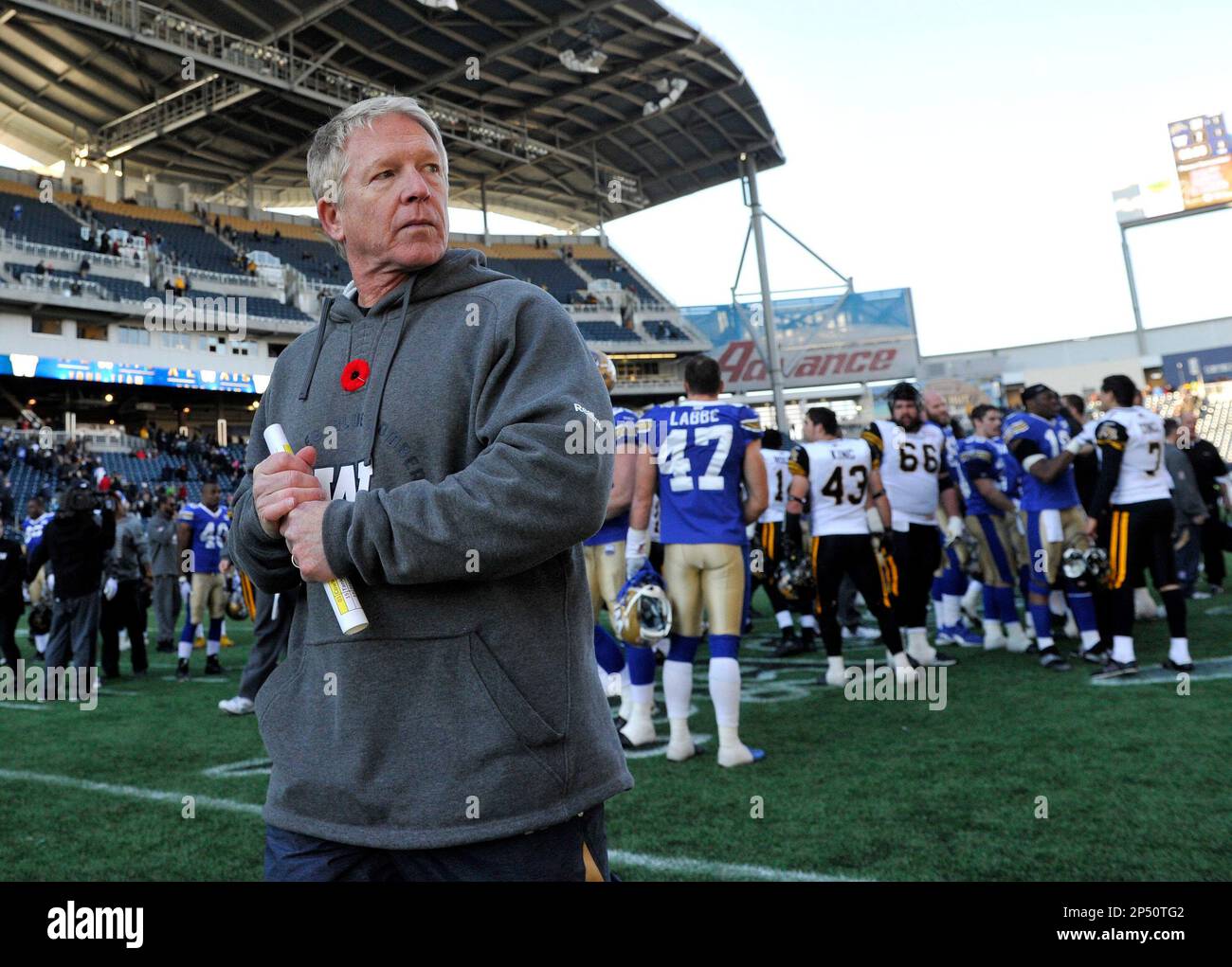 Winnipeg Blue Bombers coach Tim Burke walks off the field after the ...