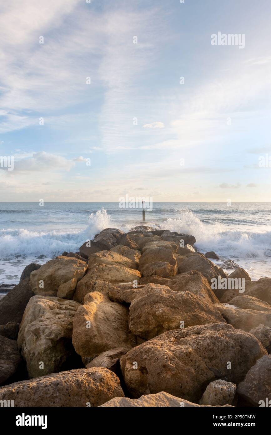 Southbourne Dorset, boulder sea defence with waves Stock Photo - Alamy