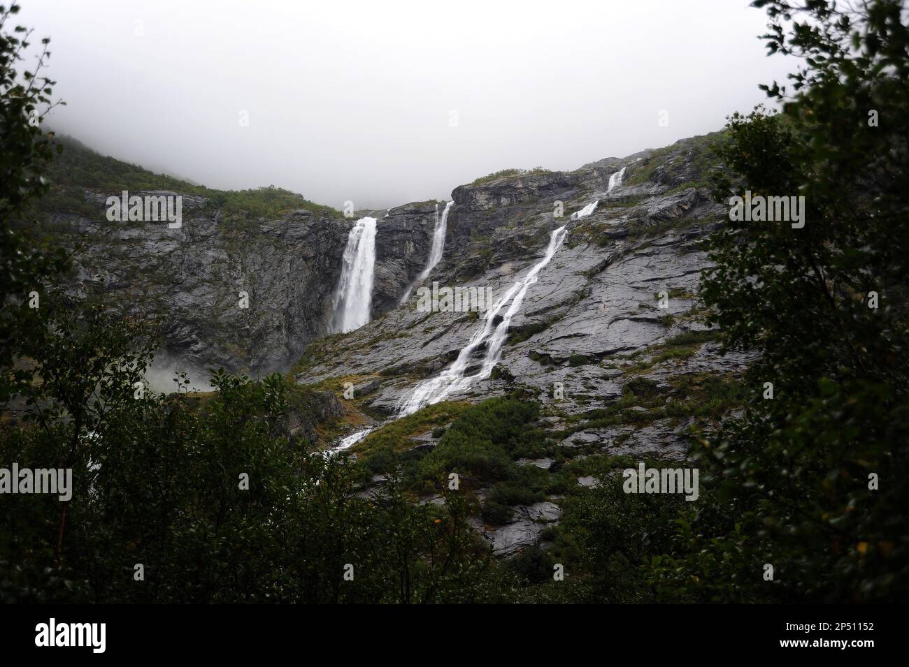 The 400 feet sheer drop of Krunefossen - a waterfall with a total ...