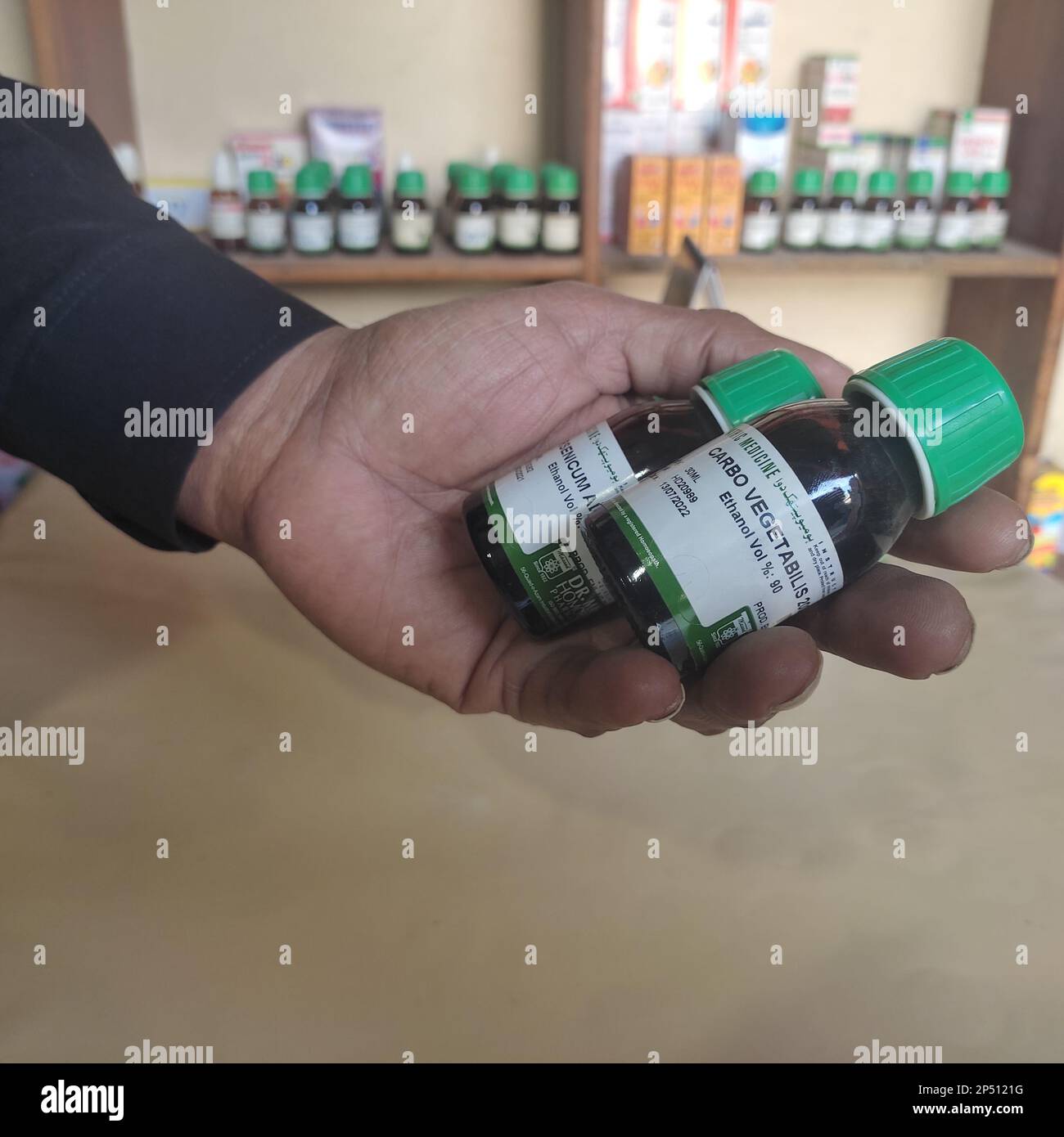 Closeup image of homeopathic medicine consisting of the pills and a ...