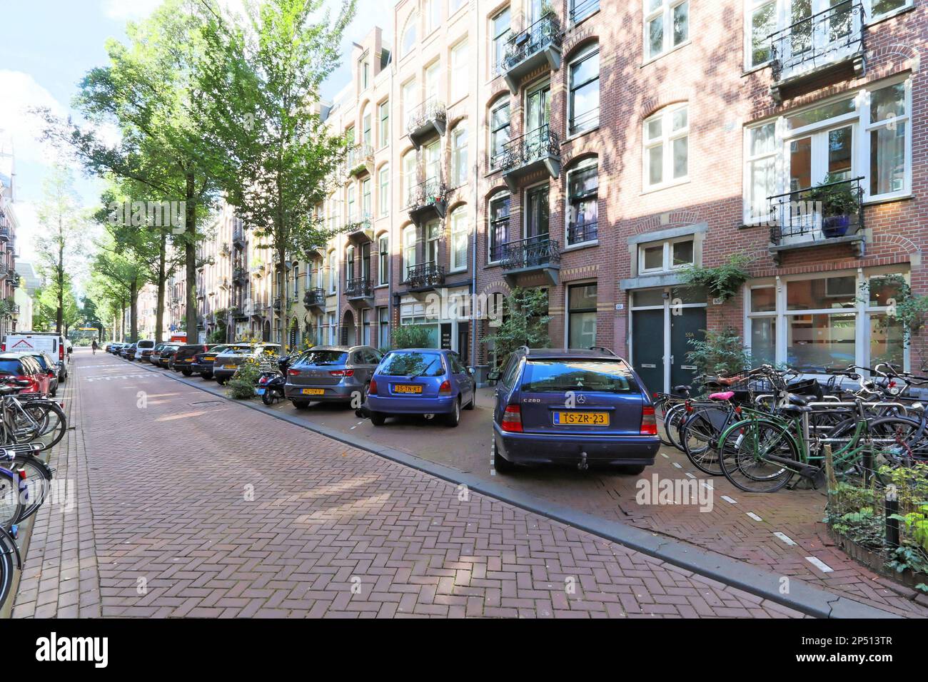 Amsterdam, Netherlands - 10 April, 2021: some cars parked on the side ...