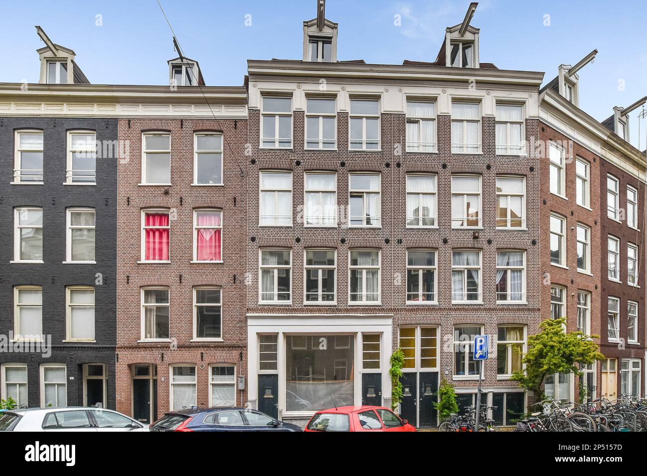 Amsterdam, Netherlands - 10 April, 2021: some cars parked on the side ...
