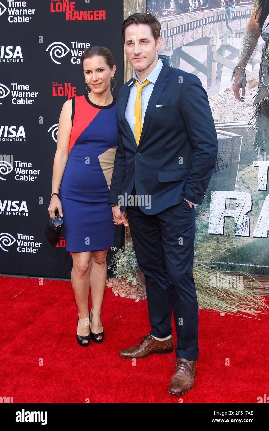 Actor Sam Jaeger (R) and Amber Jaeger attend the premiere Of Walt ...