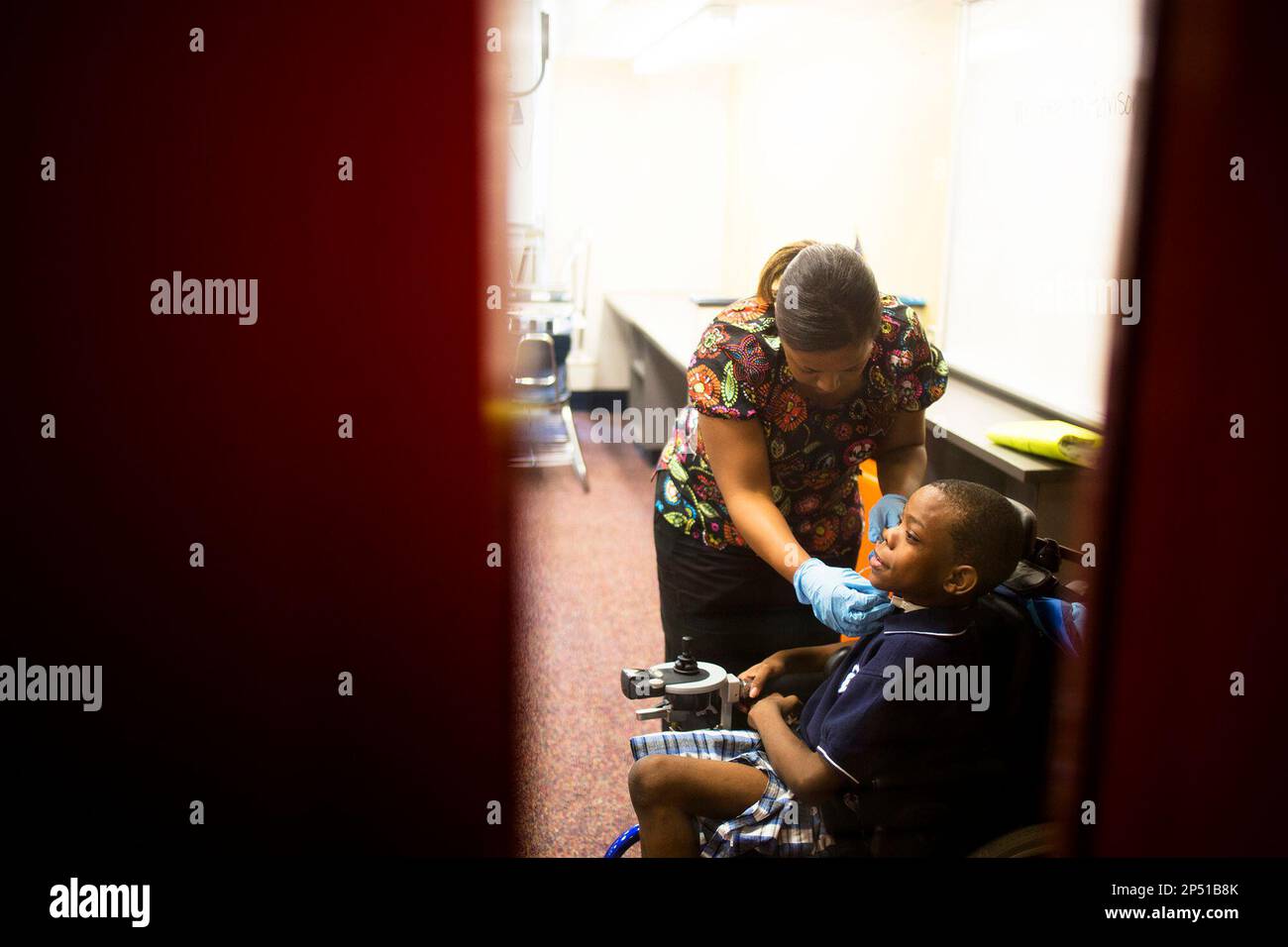 In a Friday, Sept. 13, 2013 photo, Twila Ware, Dallas Henderson's day ...