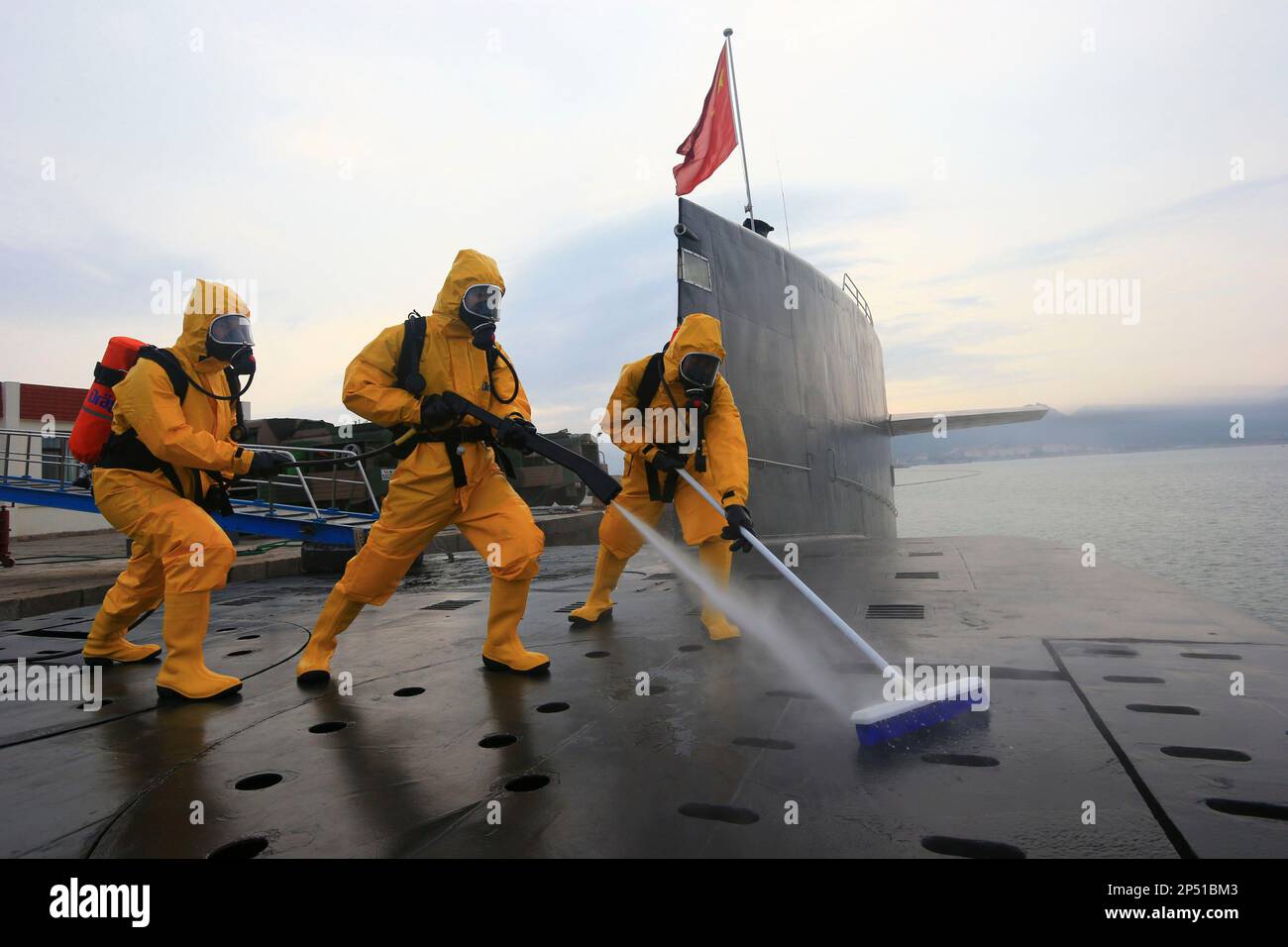 Soldiers clean and disinfect a nuclear submarine at the Qingdao ...