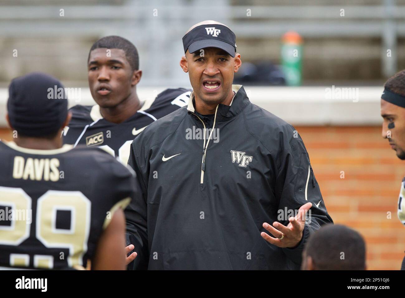 Wake Forest Demon Deacons secondary coach Derrick Jackson talks to his ...