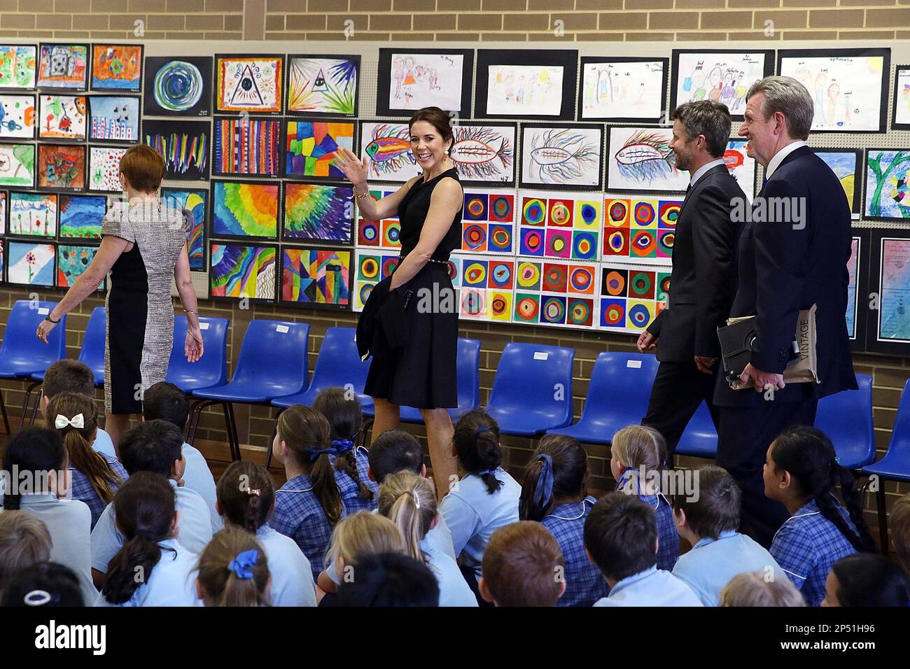 Denmark's Princess Mary, center, waves to school children as she and ...