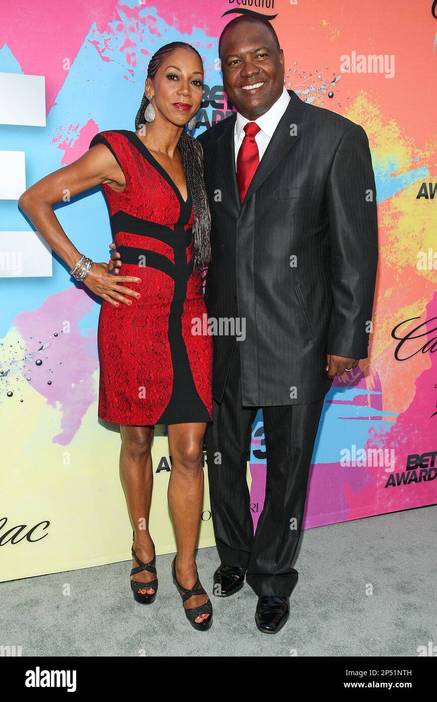 Actress Holly Robinson Peete and husband Rodney Peete attend Debra L ...