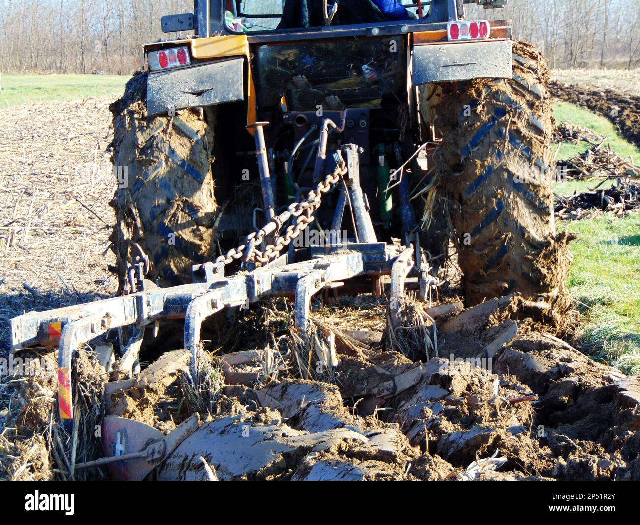 tractor on the field at farm Stock Photo - Alamy