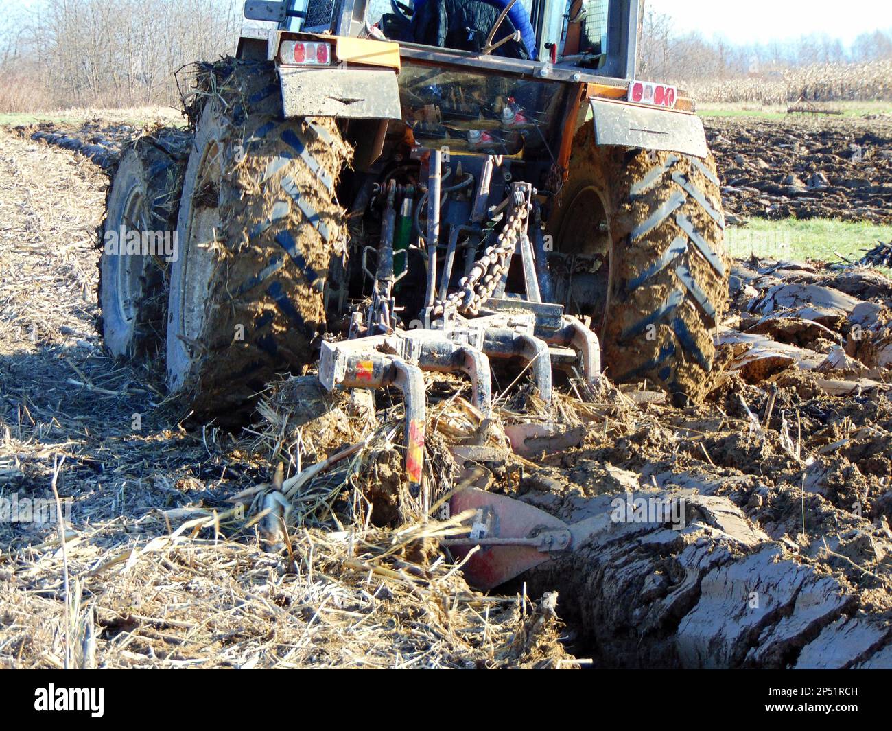 tractor on the field at farm Stock Photo - Alamy