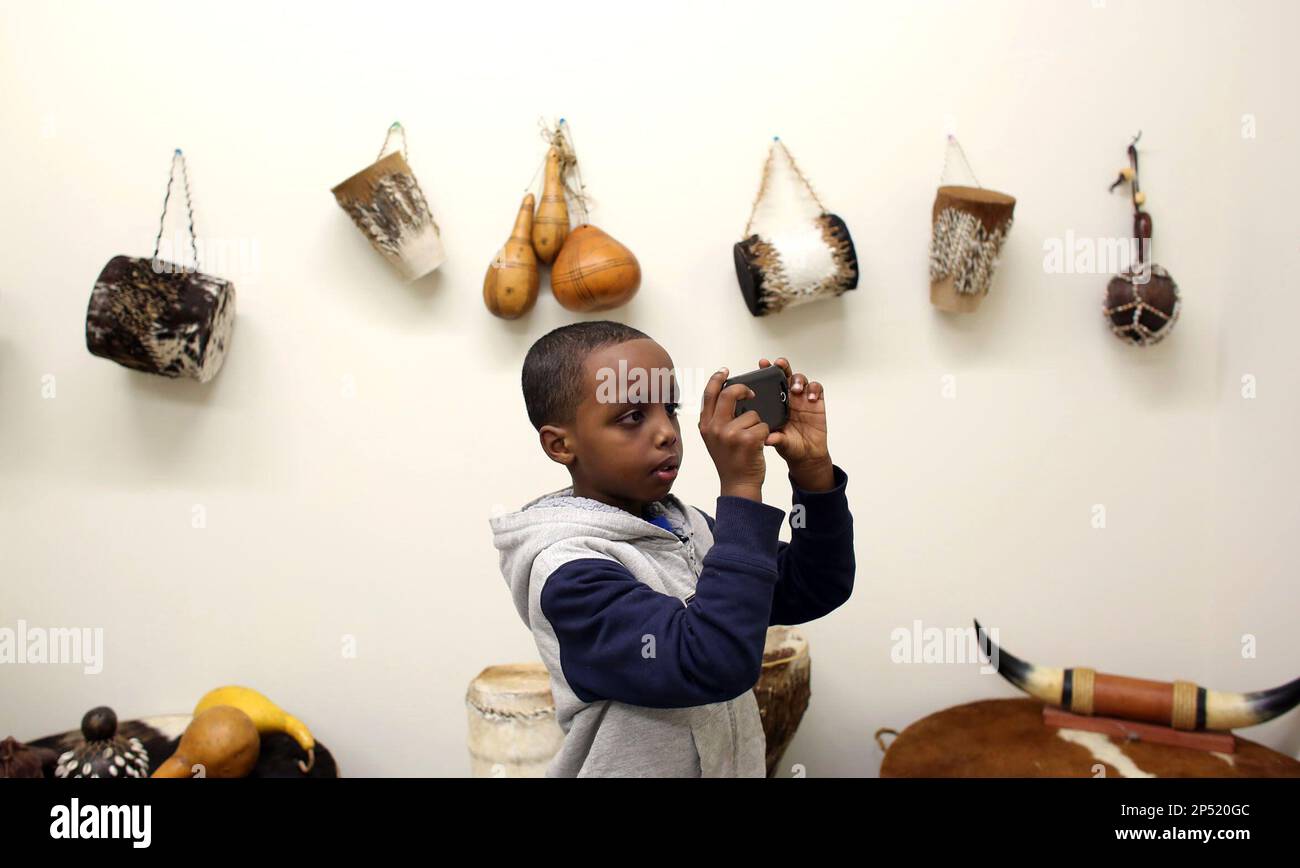 Suber Aden, 6, of St. Paul, takes pictures of traditional Somali ...