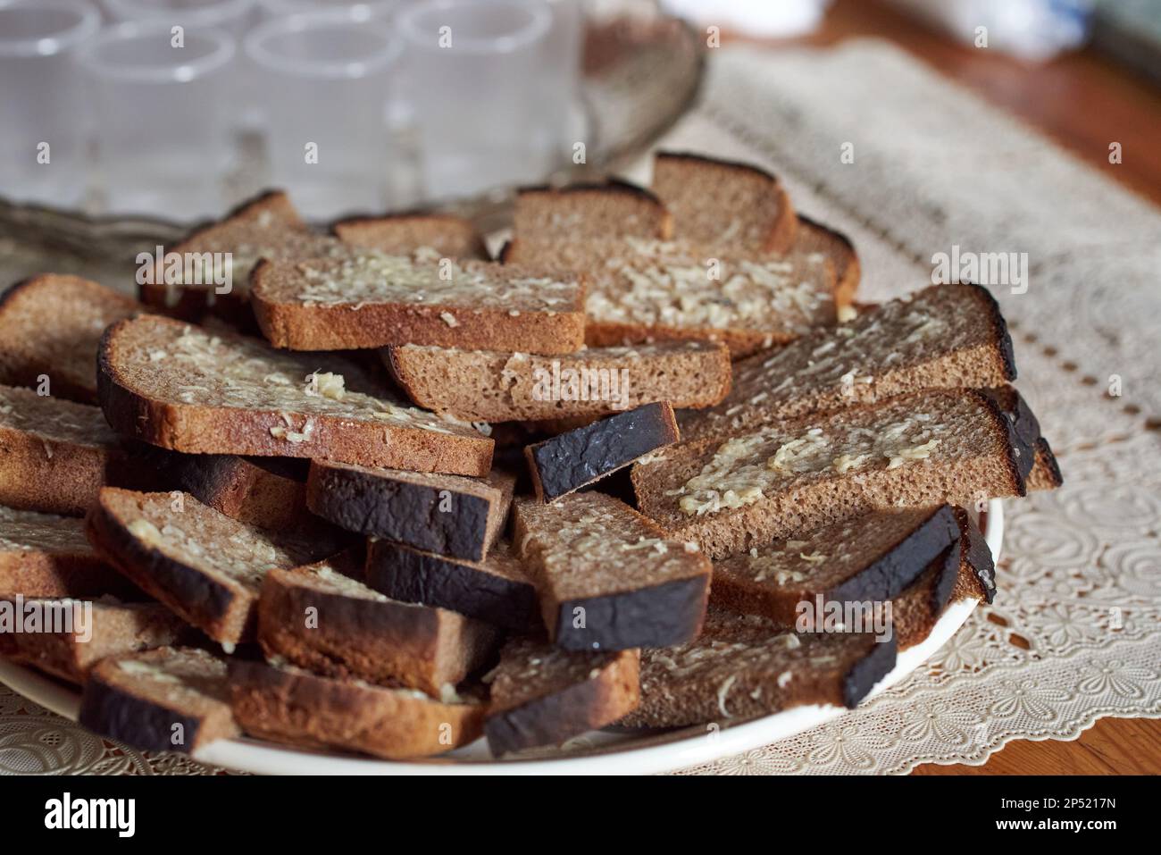 A slice of rye bread, greased with grated garlic Stock Photo - Alamy