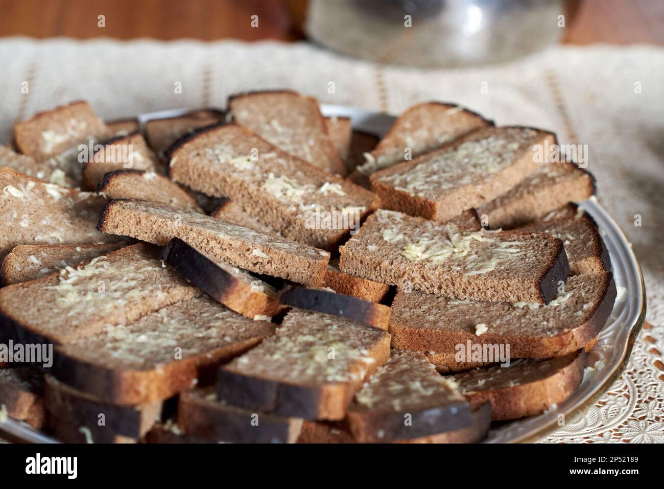 A slice of rye bread, greased with grated garlic Stock Photo - Alamy