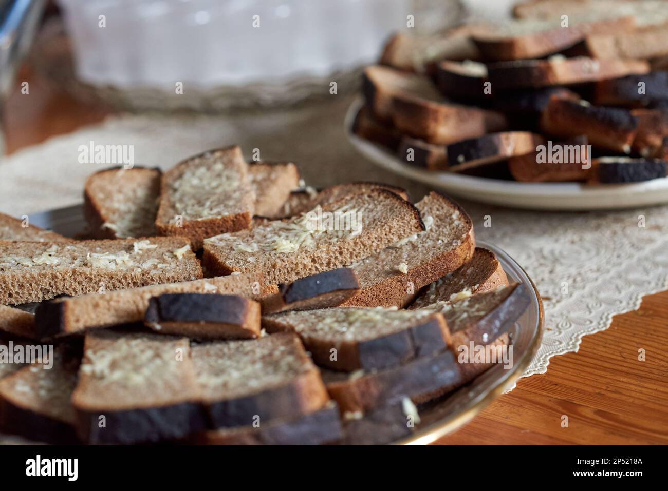 A slice of rye bread, greased with grated garlic Stock Photo - Alamy