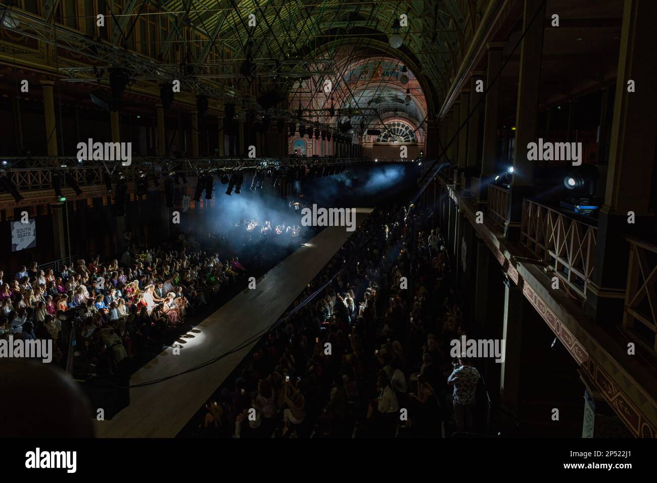 The lights dim on the runway as the finale of the Utopia runway show ...