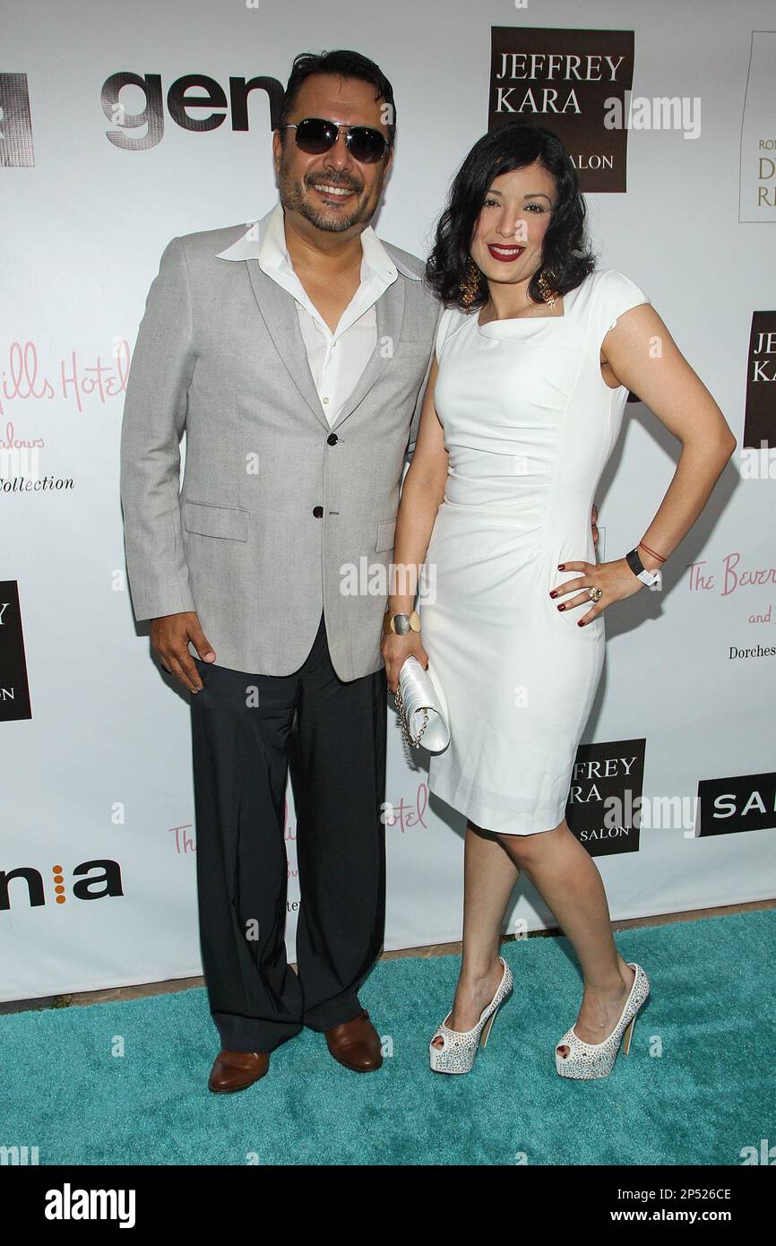 Alex Flores (L) and guest attend "The Fountain Of Youth White Party" To ...