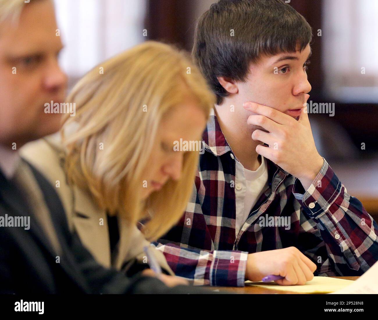Isaiah R. Sweet, 18, sits with his defense team during his trial at the ...