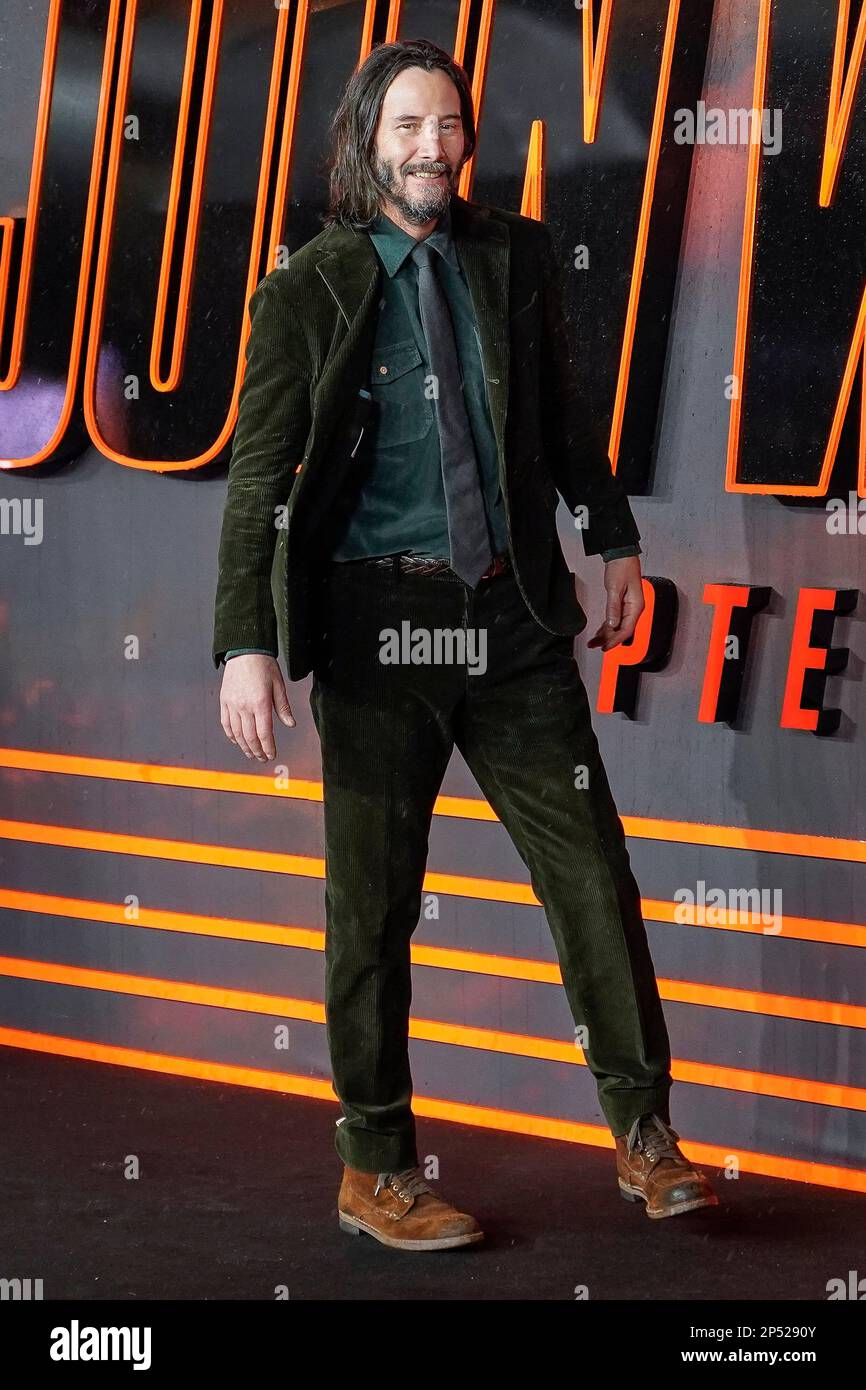 Keanu Reeves poses for photographers upon arrival at the premiere of ...