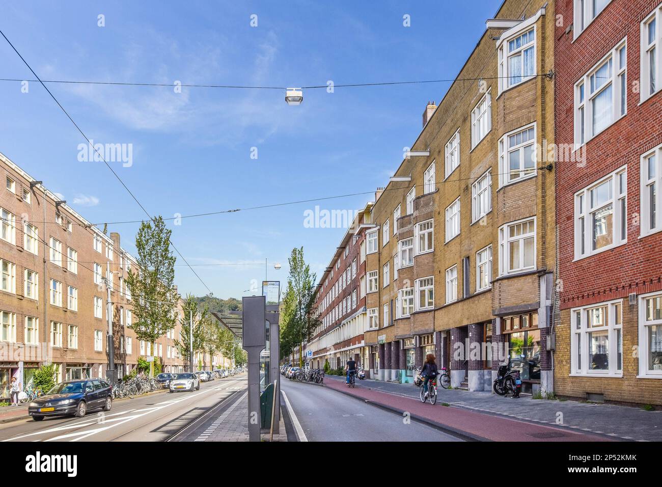 Amsterdam, Netherlands - 10 April, 2021: a city street with cars parked ...