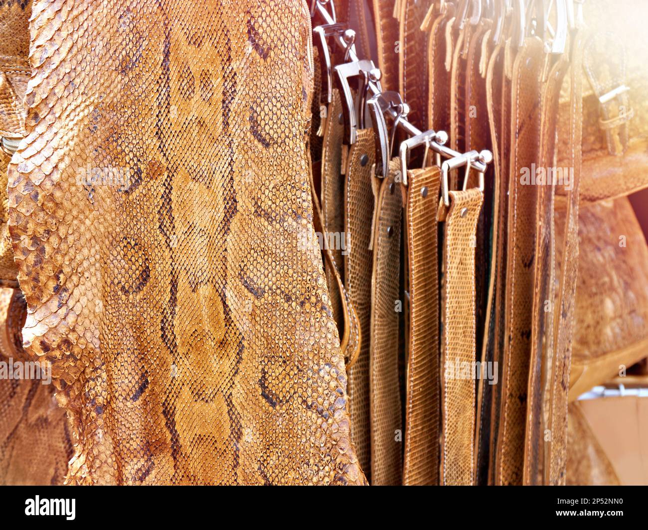Products made of snake skin on the market Stock Photo - Alamy
