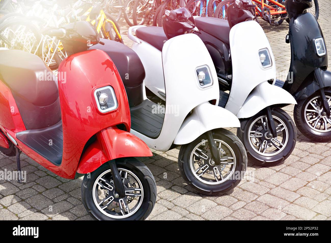 Electric scooters for rent in the parking lot in sunny weather Stock ...