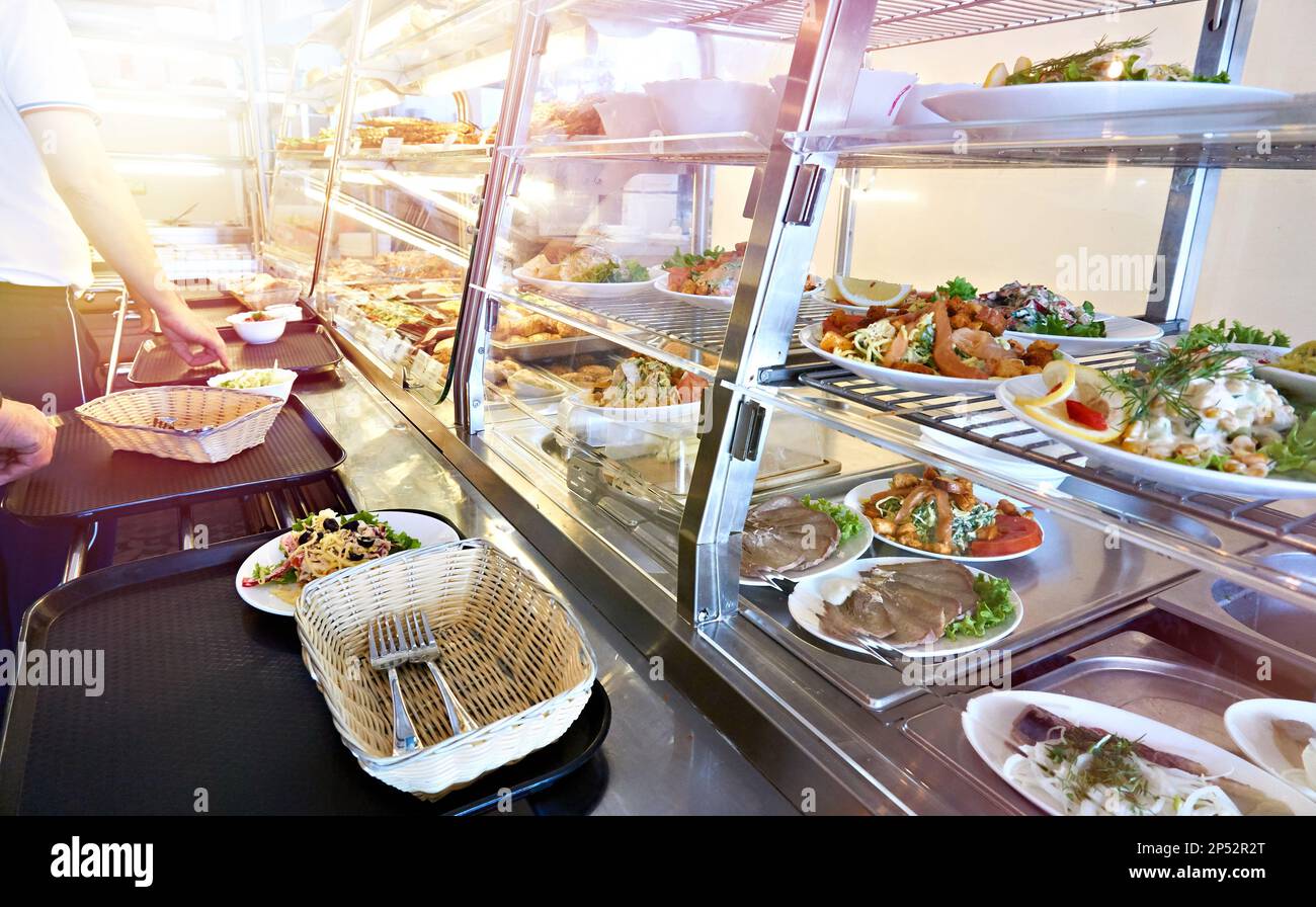 Public dining counter with food Stock Photo - Alamy