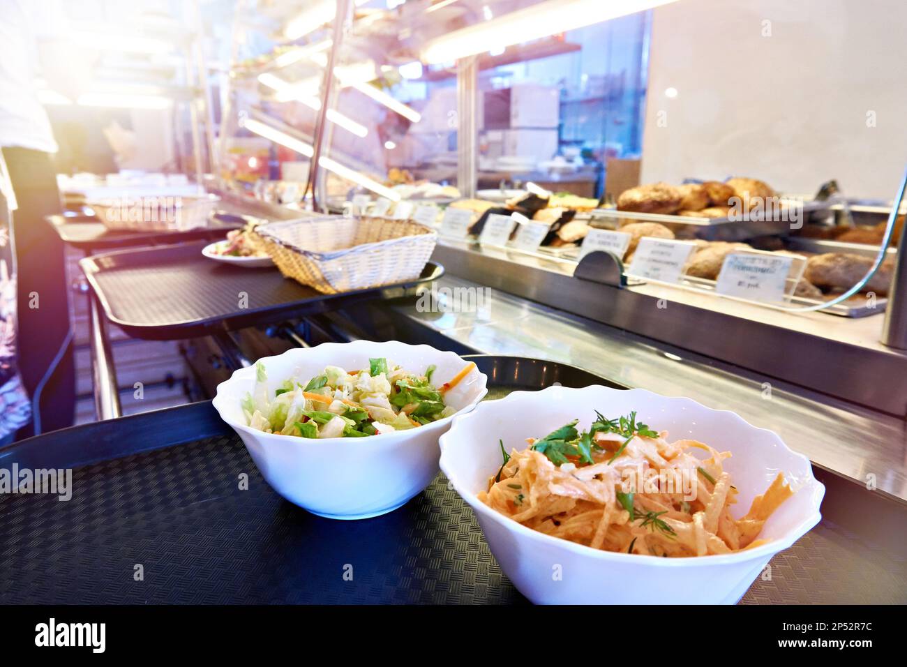 Vegetable salads on the counter of public dining room Stock Photo - Alamy