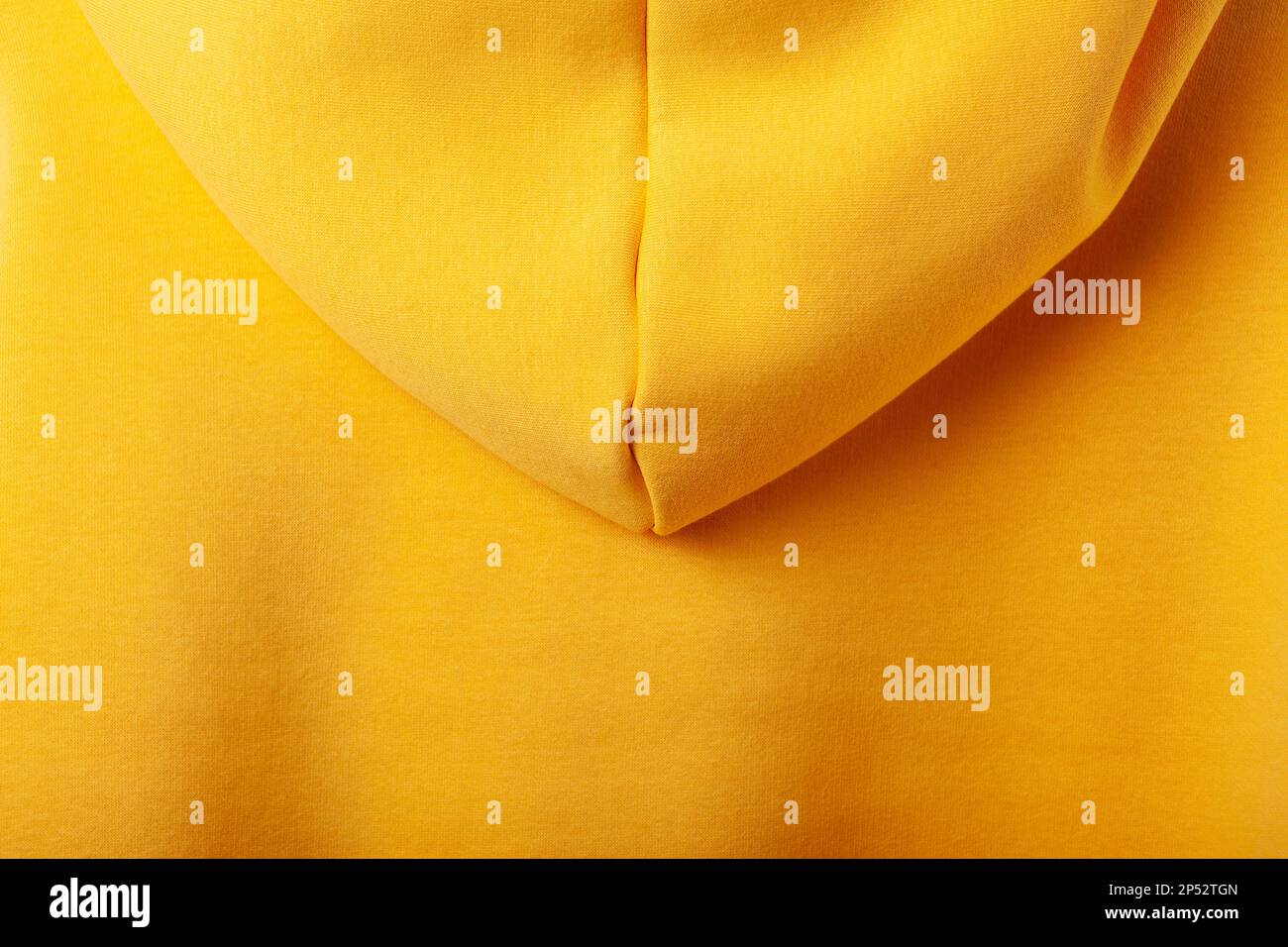 Autumn concept - yellow hoodie background, back view with hood Stock ...