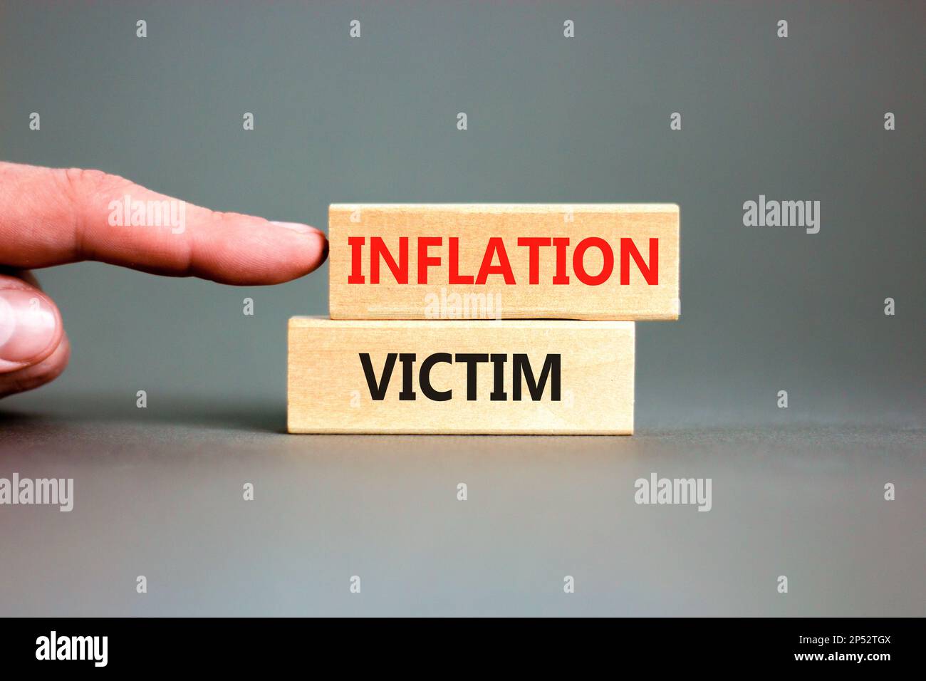 Inflation victim symbol. Concept words Inflation victim on wooden block ...