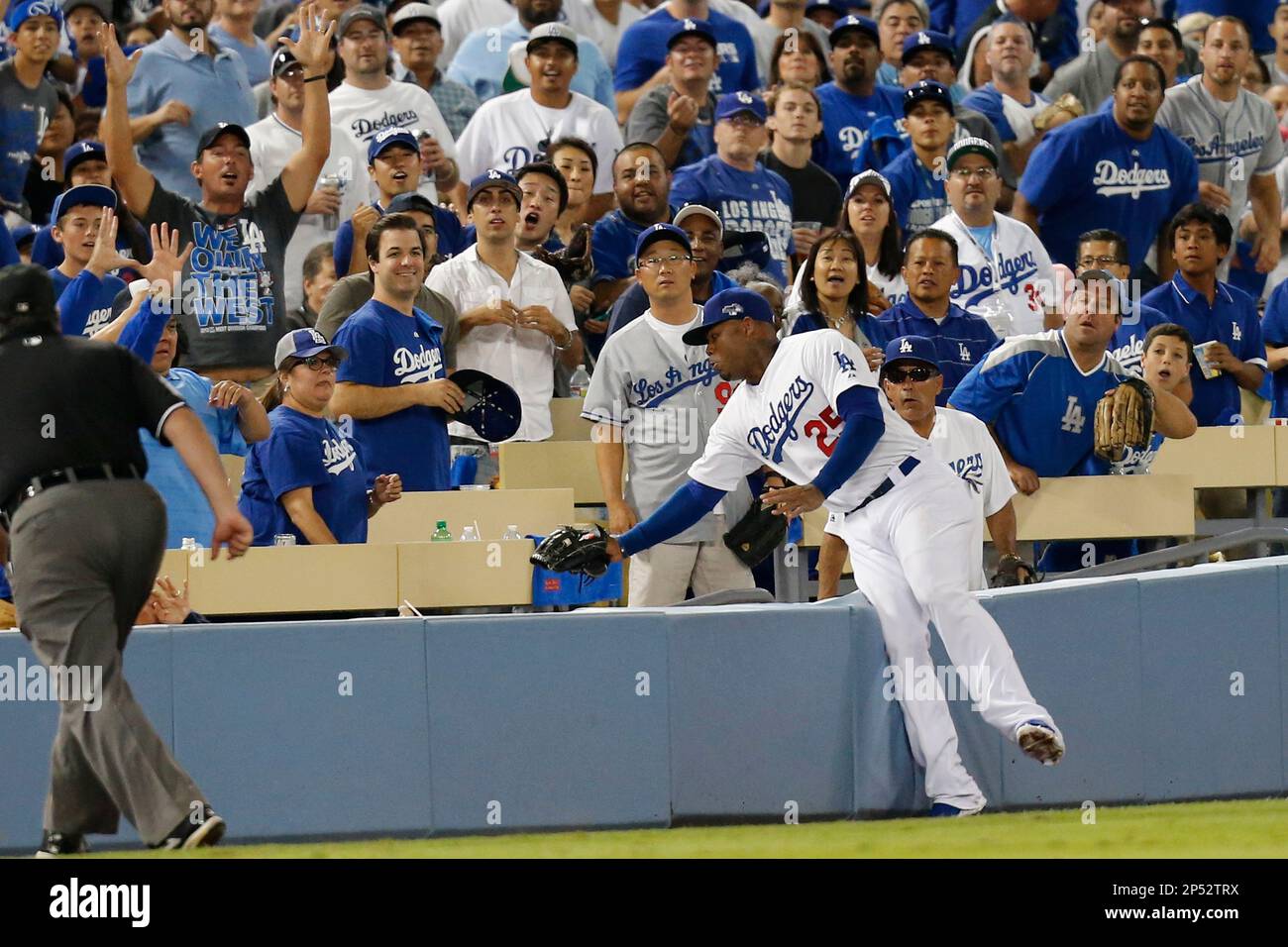 Los Angeles Dodgers left fielder Carl Crawford (25) dives over the ...