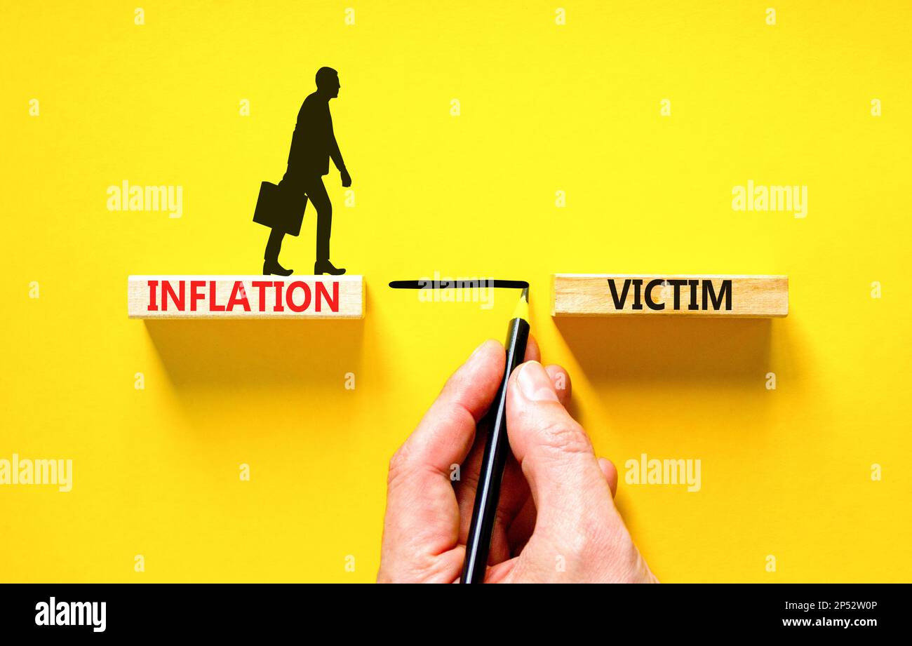 Inflation victim symbol. Concept words Inflation victim on wooden block ...