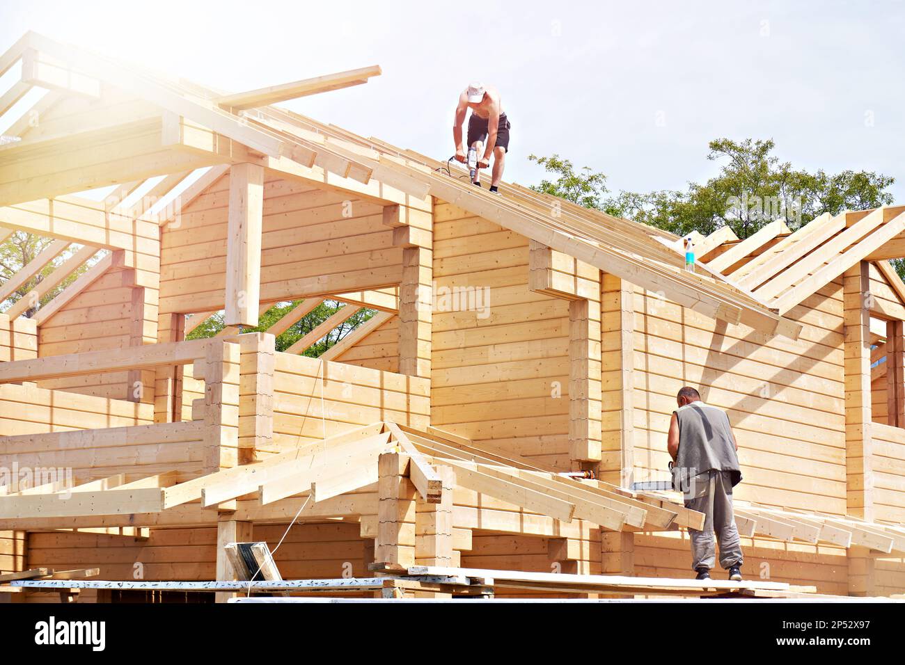 Construction of a wooden house Stock Photo - Alamy