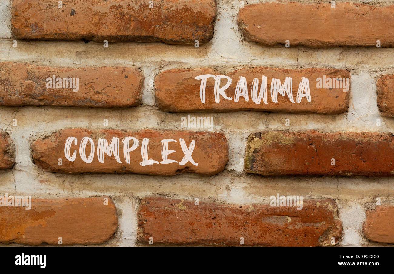 Complex trauma symbol. Concept words Complex trauma on red brown brick ...