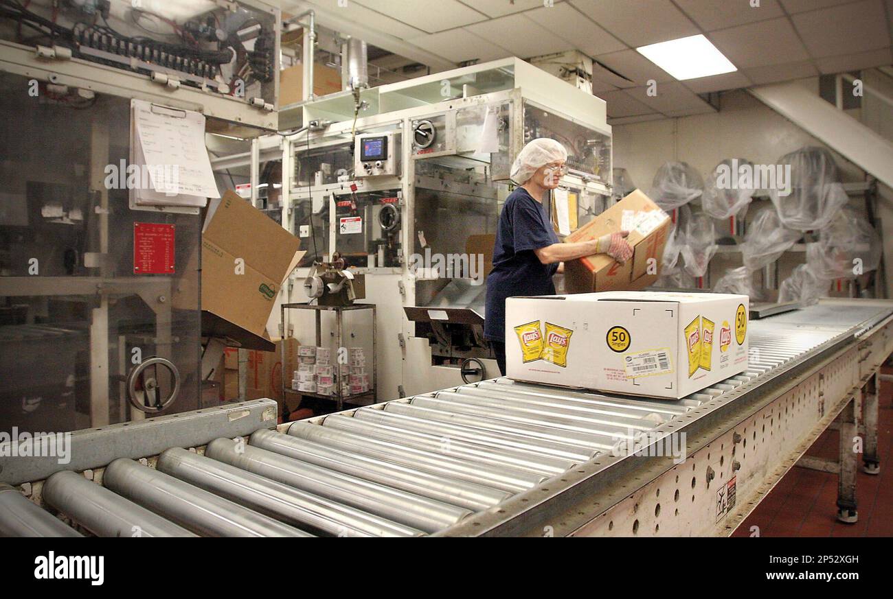 In this Sept. 9, 2013 photo, Helen Kefalas packs bags of Lays potato ...