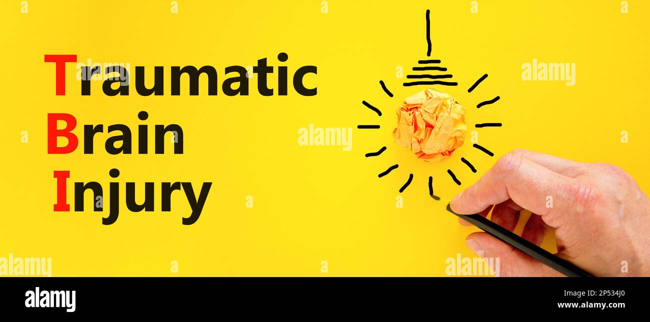 TBI traumatic brain injury symbol. Concept words TBI traumatic brain injury on paper on ...