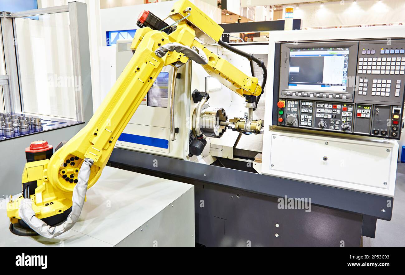 Robotic arm and cnc lathe machine Stock Photo - Alamy