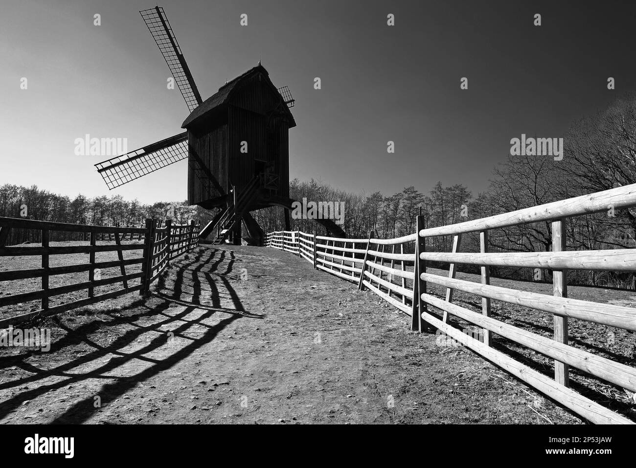 scenic silhouette of a historic german windmill in black and white ...