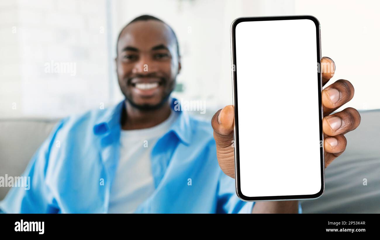 Smiling Black Man Showing Smartphone With Big Blank White Screen At ...