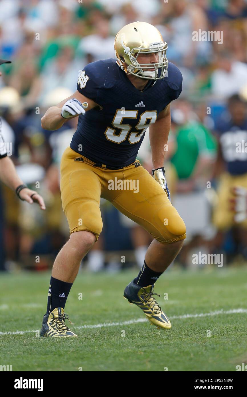 Notre Dame linebacker Jarrett Grace (59) runs during NCAA Football game ...