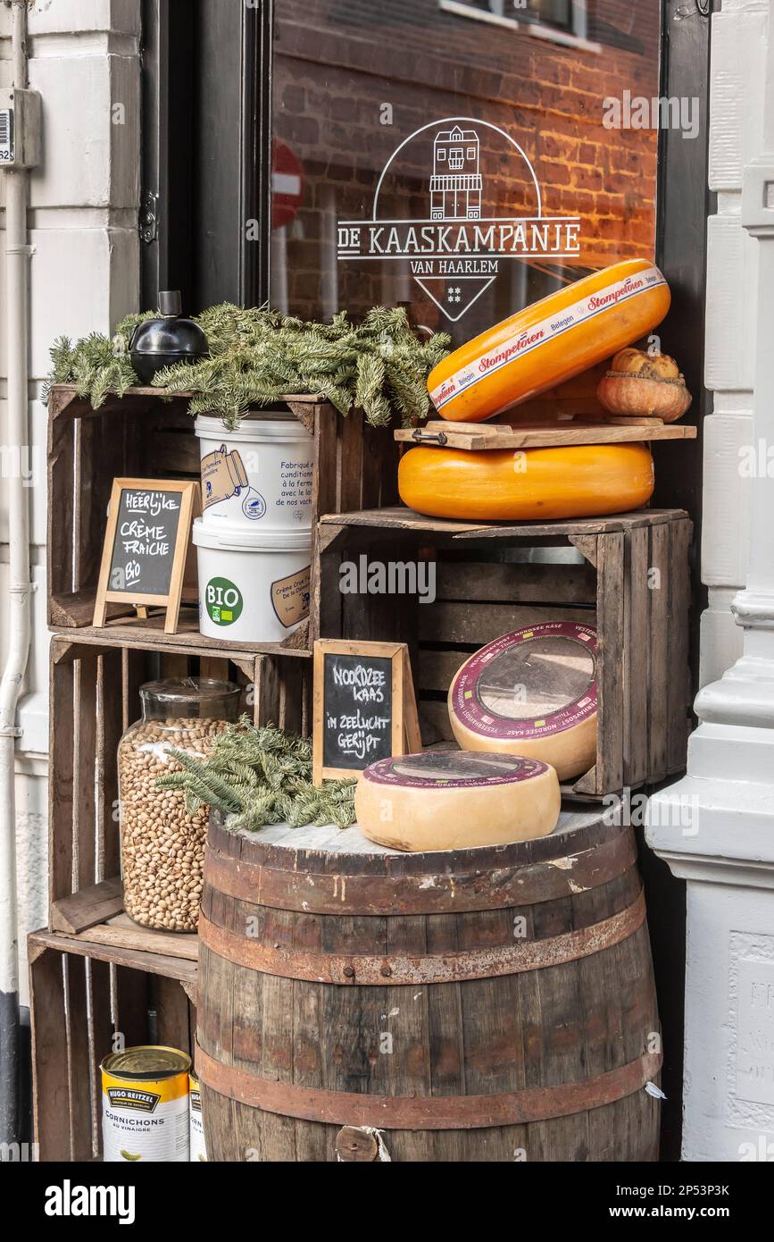 Various Dutch cheeses displayed on a wooden box and a wooden rain ...