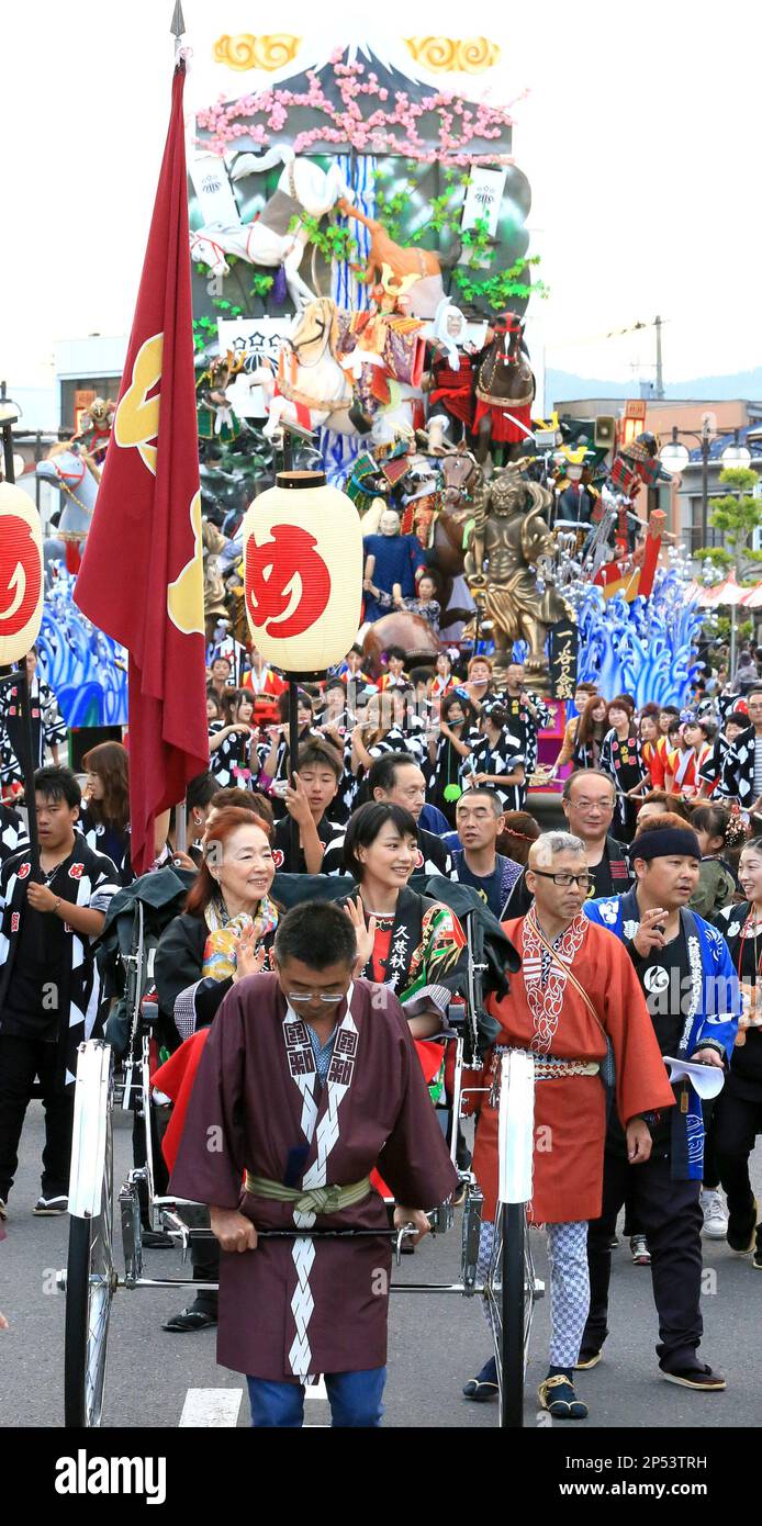 Actress Rena Nonen ,(R) and Nobuko Miyamoto ride an rickshaw in a ...