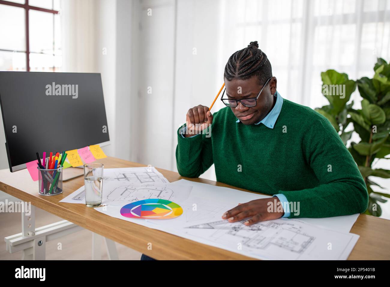 Pensive Black Engineer Man Making Technical Drawing Of Object Indoor ...