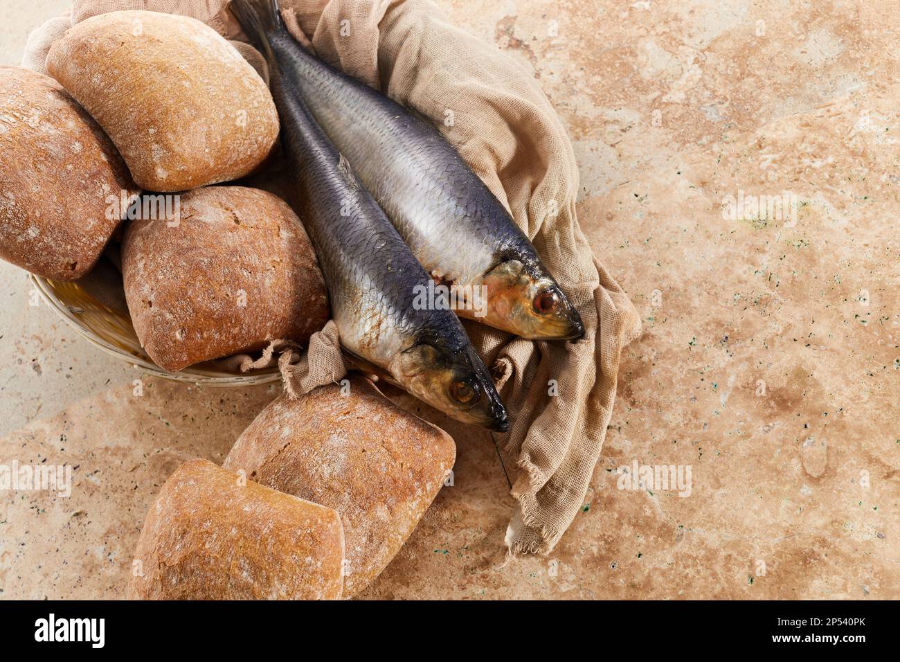 Catholic still life of five loaves of bread and two fish Stock Photo ...
