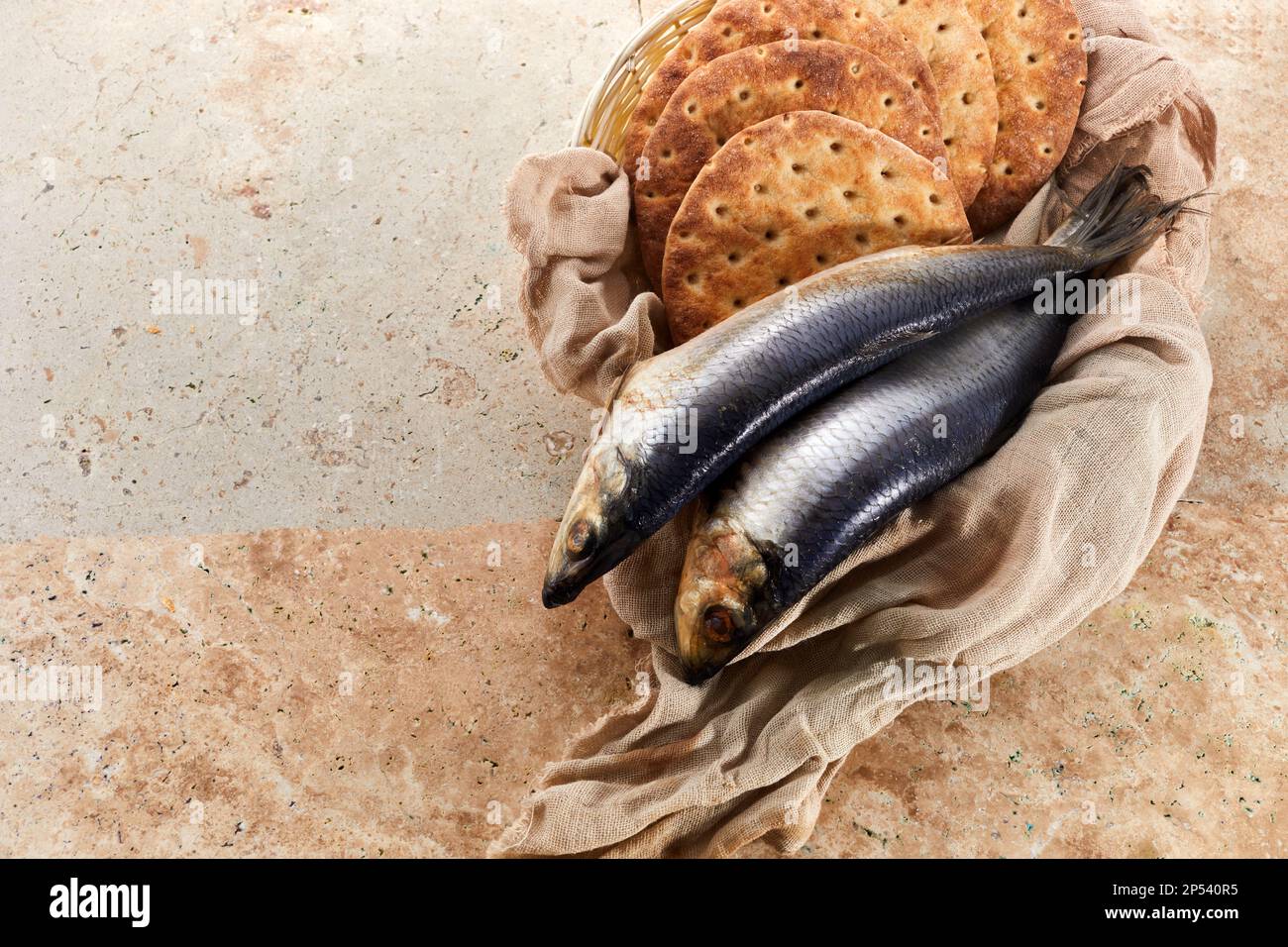 Catholic still life of five loaves of bread and two fish Stock Photo ...
